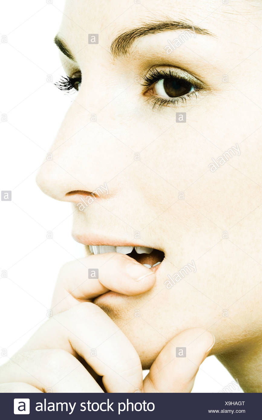 Woman Biting Finger High Resolution Stock Photography and Images - Alamy