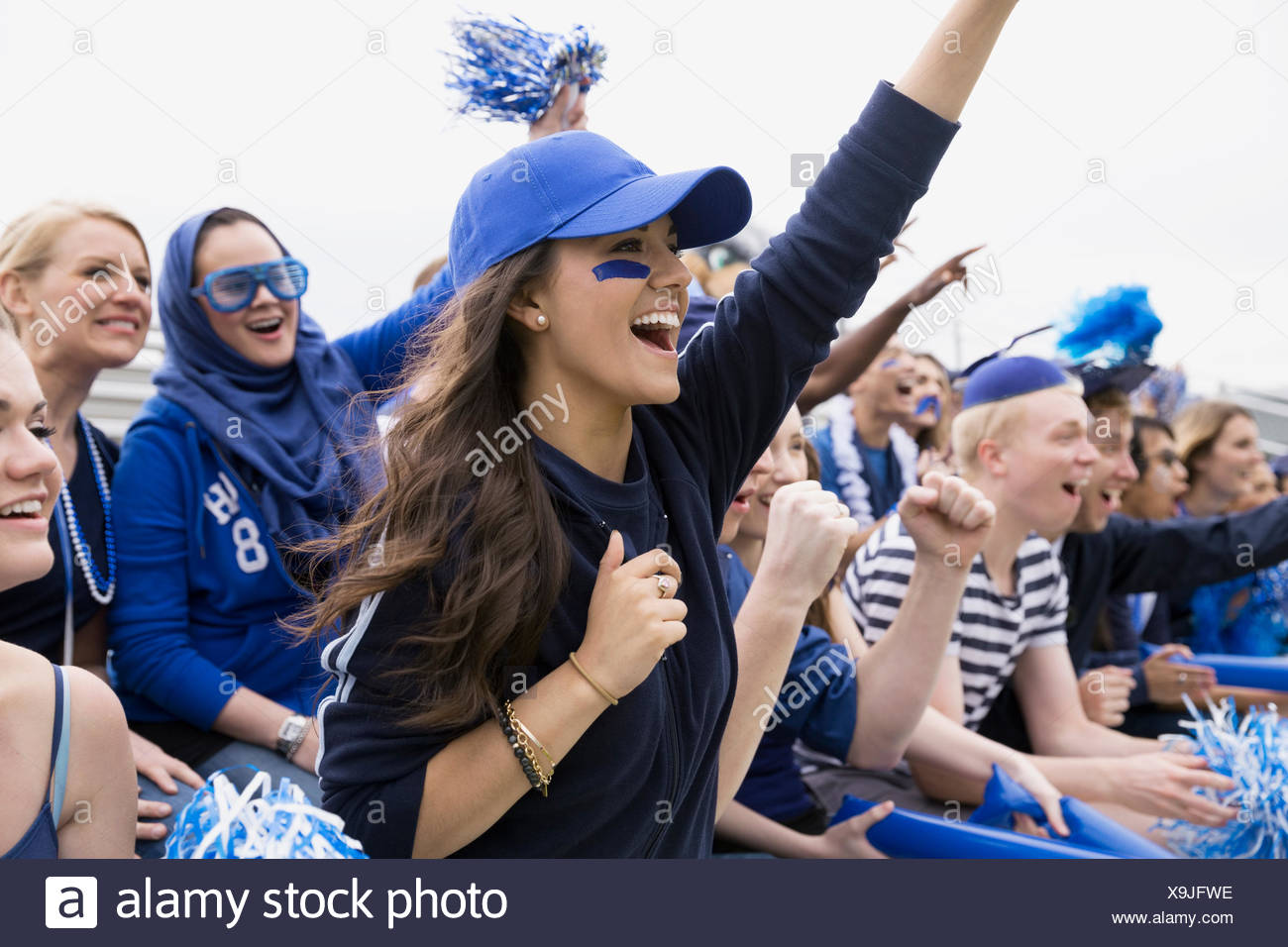 Crowd People Sitting In Bleachers Stock Photos & Crowd People Sitting ...