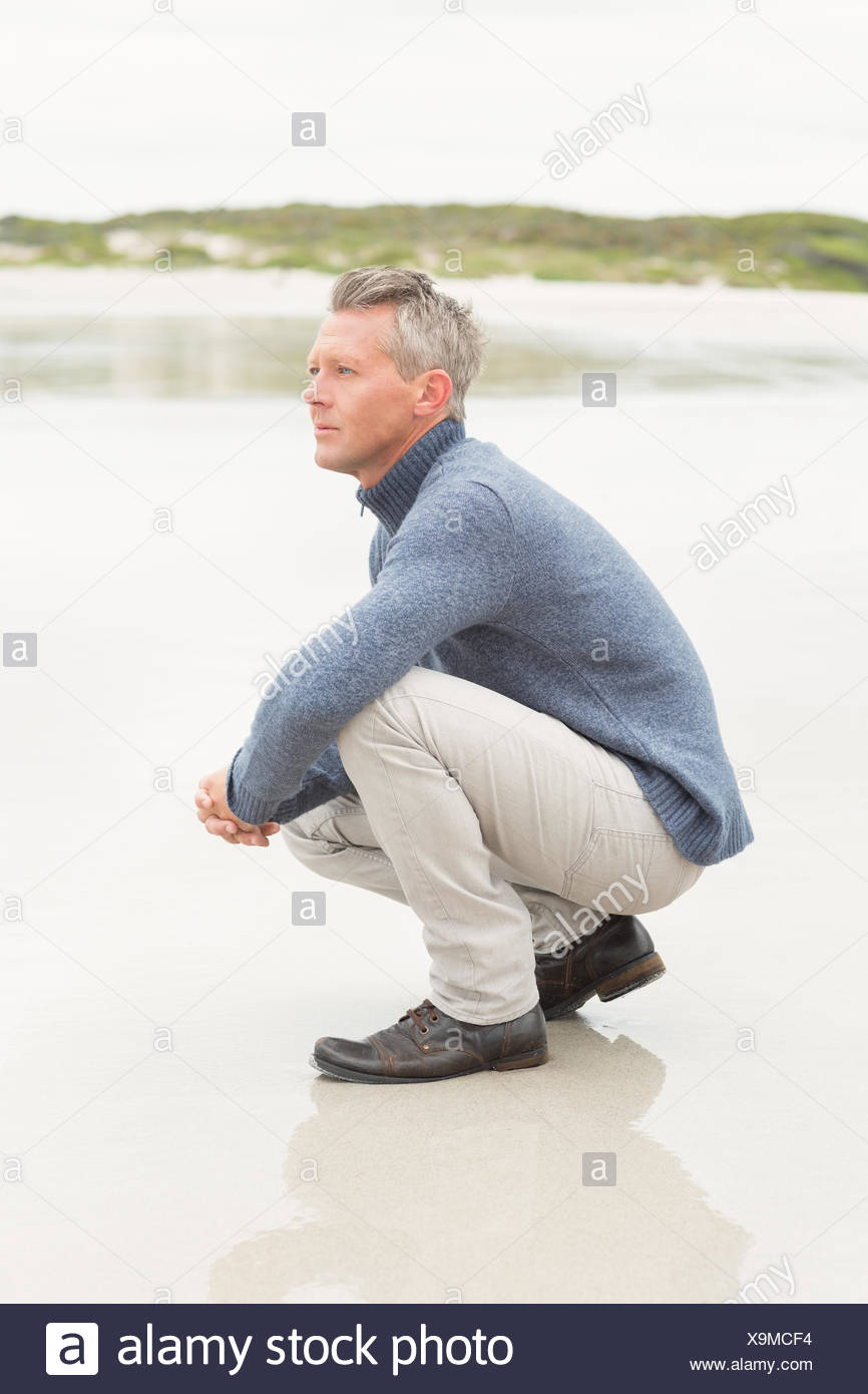 Man Crouched Down High Resolution Stock Photography and Images - Alamy