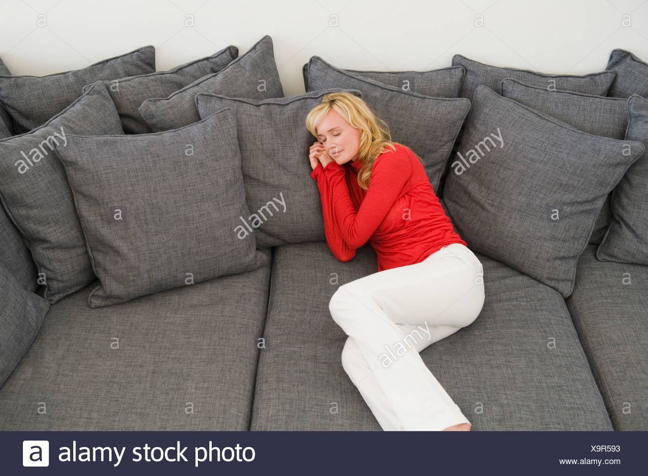 Young Woman Reclining On Couch High Resolution Stock Photography and ...