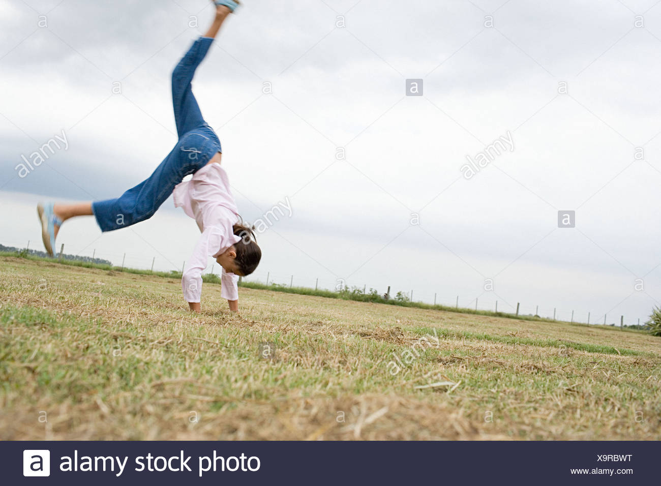 Girl Doing A Cartwheel High Resolution Stock Photography and Images - Alamy