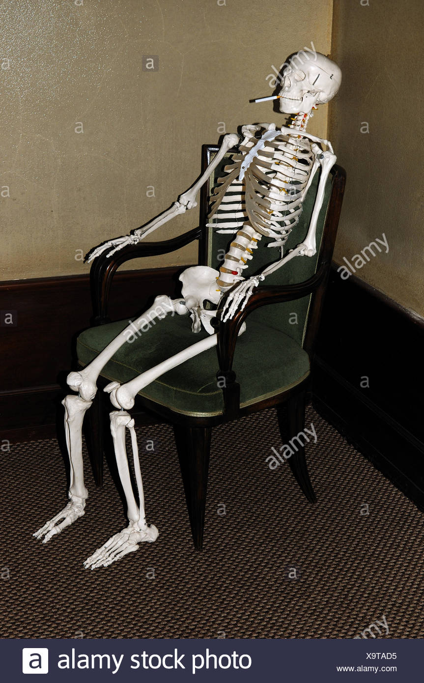 Skeleton Sitting Chair Stock Photos & Skeleton Sitting Chair Stock ...