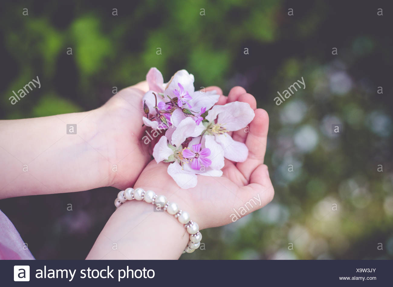 Hands And Flowers High Resolution Stock Photography and Images - Alamy