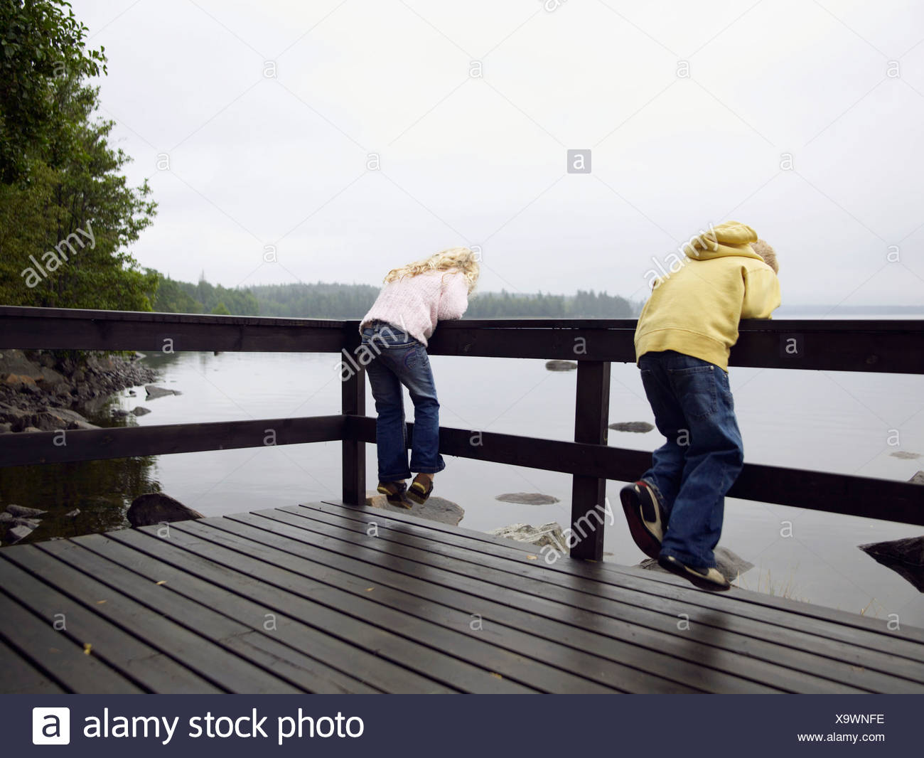 Leaning Over Rail Stock Photos & Leaning Over Rail Stock Images - Alamy