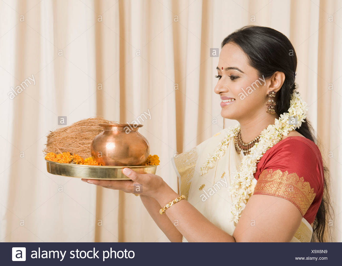 South Indian Woman Holding Pooja Stock Photos & South Indian Woman ...