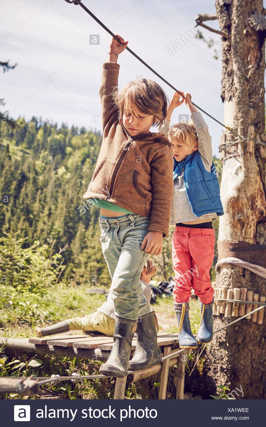Group Of People Walking Across Bridge High Resolution Stock Photography ...