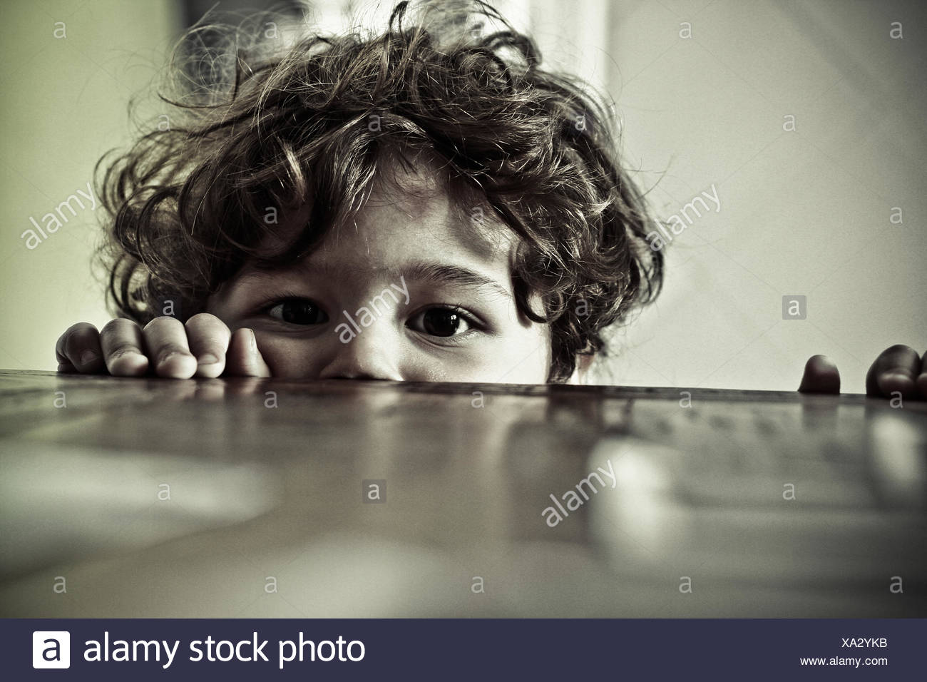 Boy Peeking Table High Resolution Stock Photography and Images - Alamy
