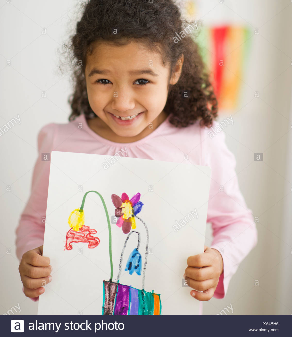Girl Holding Up Her Drawing High Resolution Stock Photography and ...