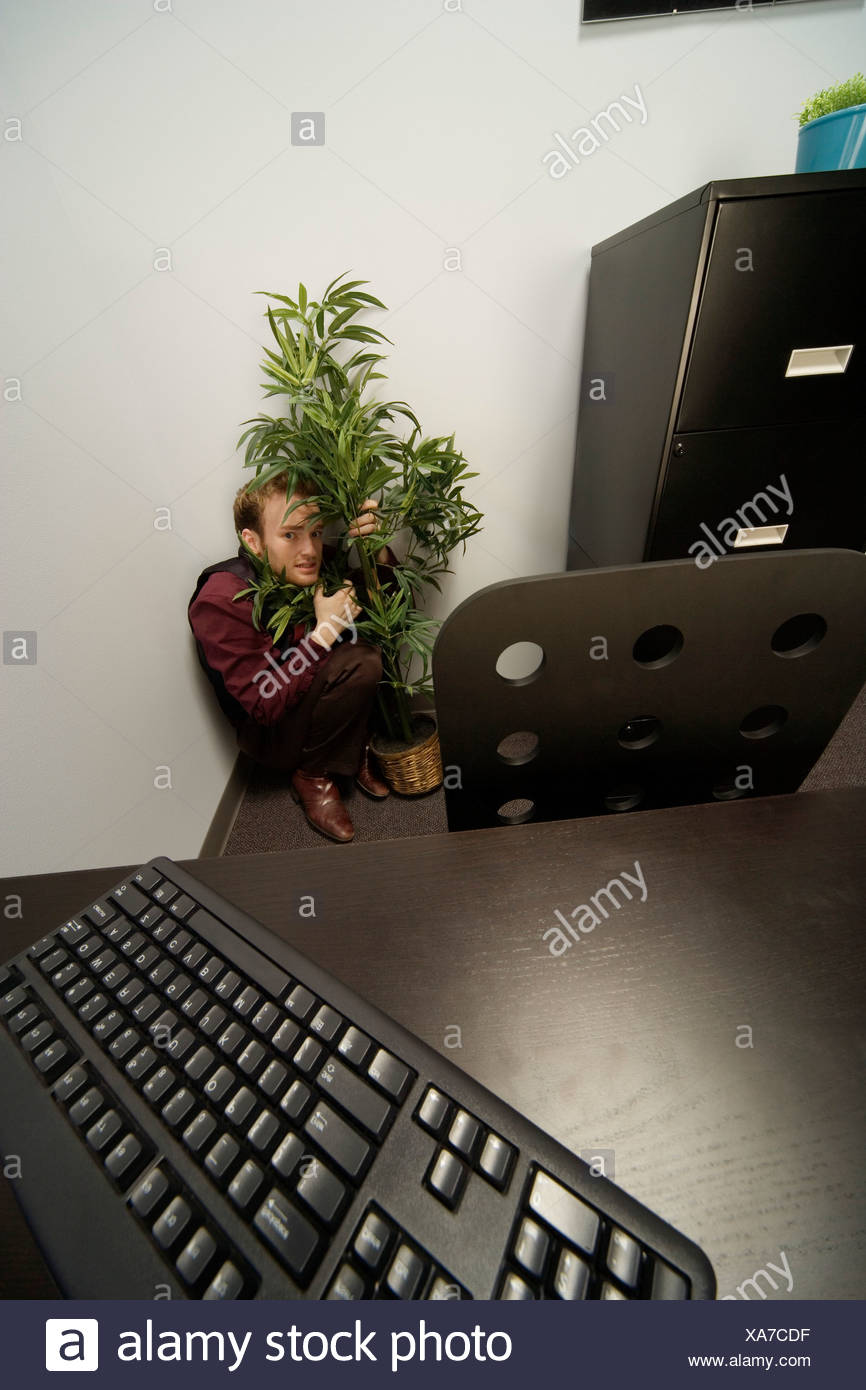 Man Crouching Scared High Resolution Stock Photography and Images - Alamy