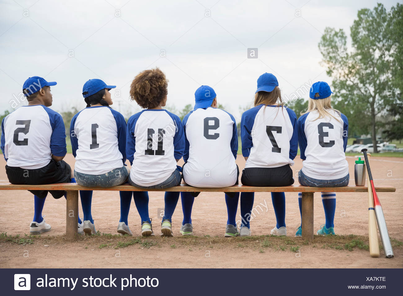 Baseball Team Sitting On Bench Stock Photos & Baseball Team Sitting On ...