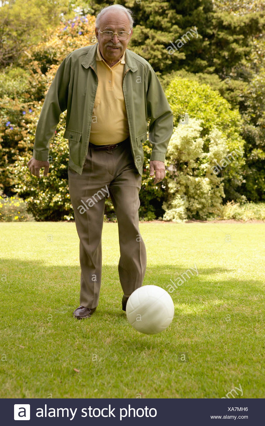 Older Man Playing Football High Resolution Stock Photography and Images ...