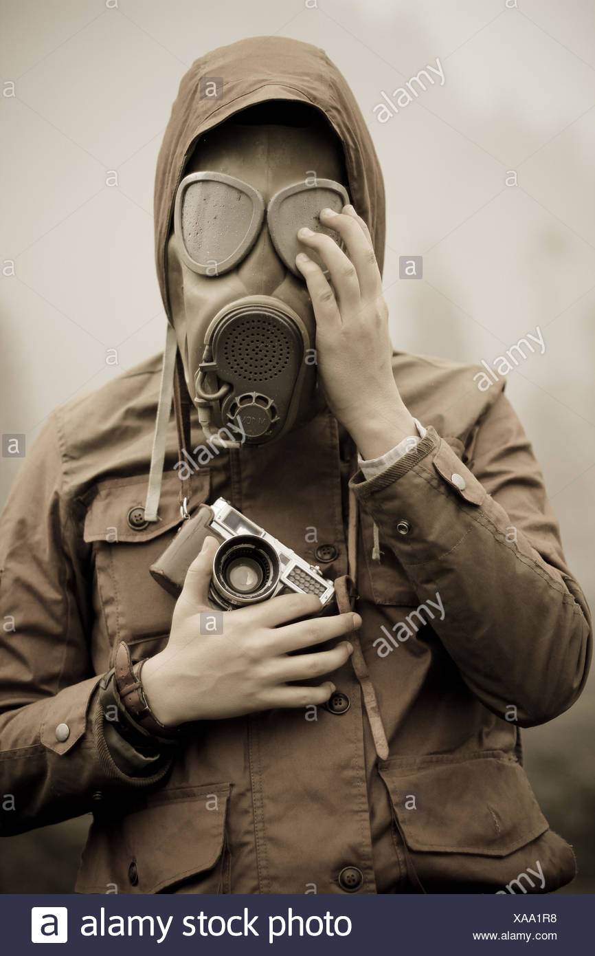 Man Holding Mask Face Stock Photos & Man Holding Mask Face Stock Images ...