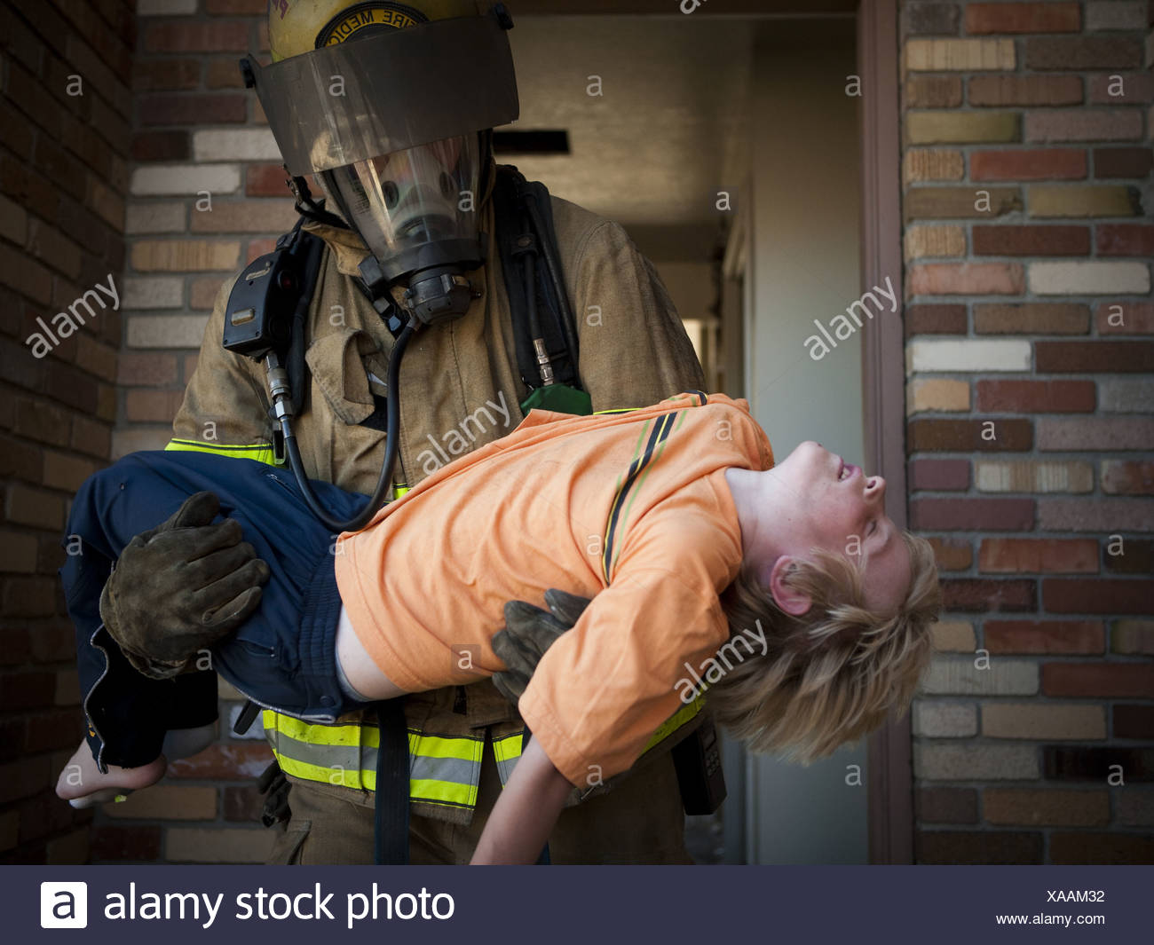 Firefighter Rescue Child Stock Photos & Firefighter Rescue Child Stock Images - Alamy