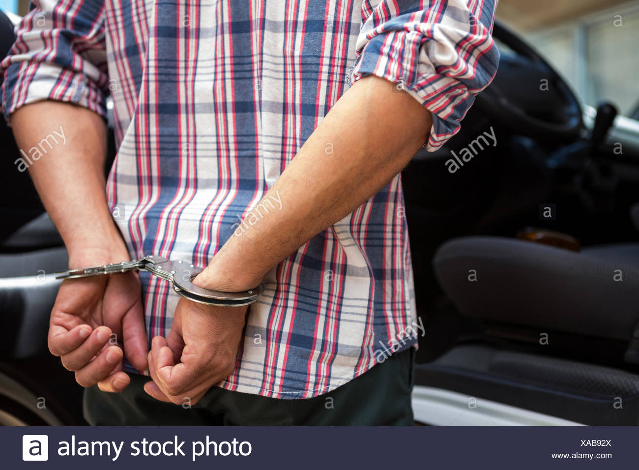 Handcuffed Behind Back Man High Resolution Stock Photography and Images ...