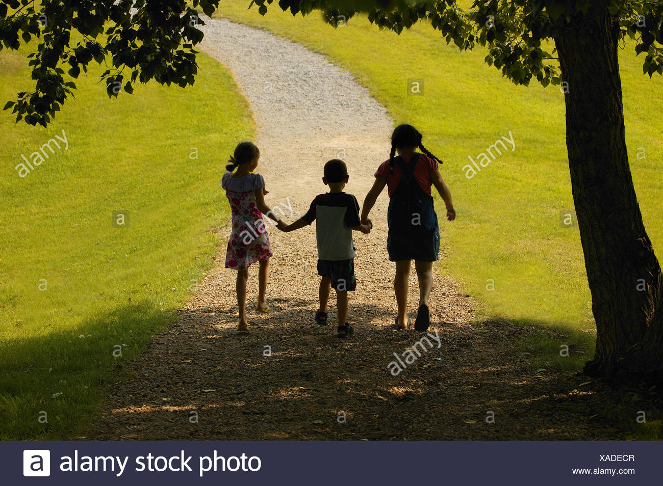 Boy Walking Behind Girl Stock Photos & Boy Walking Behind Girl Stock ...