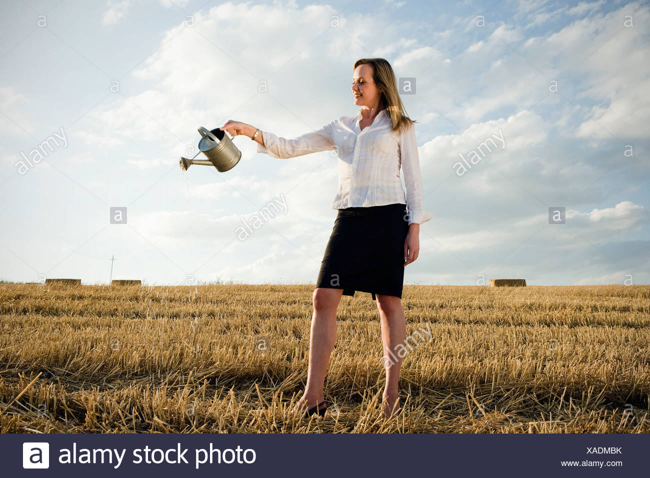 Woman Pouring Water Watering Can High Resolution Stock Photography and ...