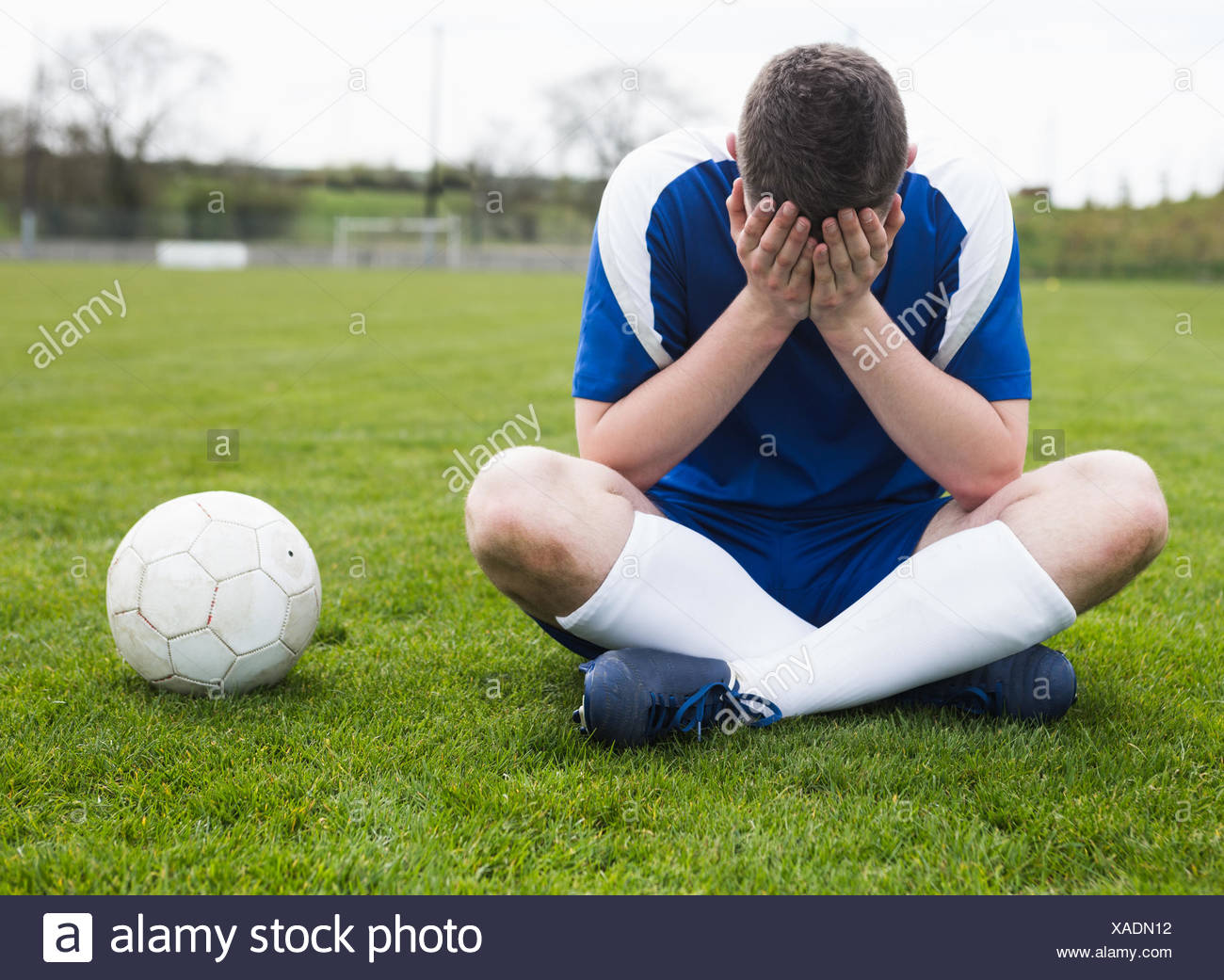 Boy Football Player Sitting In High Resolution Stock Photography and ...