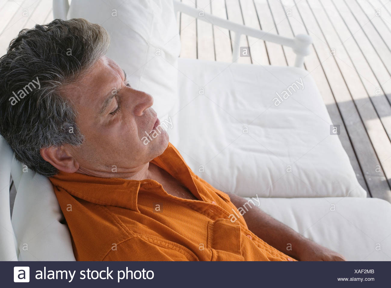 Man Laying On Lounge Chair High Resolution Stock Photography and Images ...