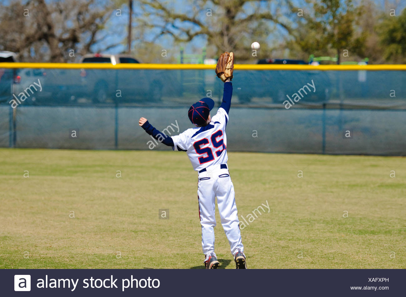 Boy Catching Ball High Resolution Stock Photography and Images - Alamy