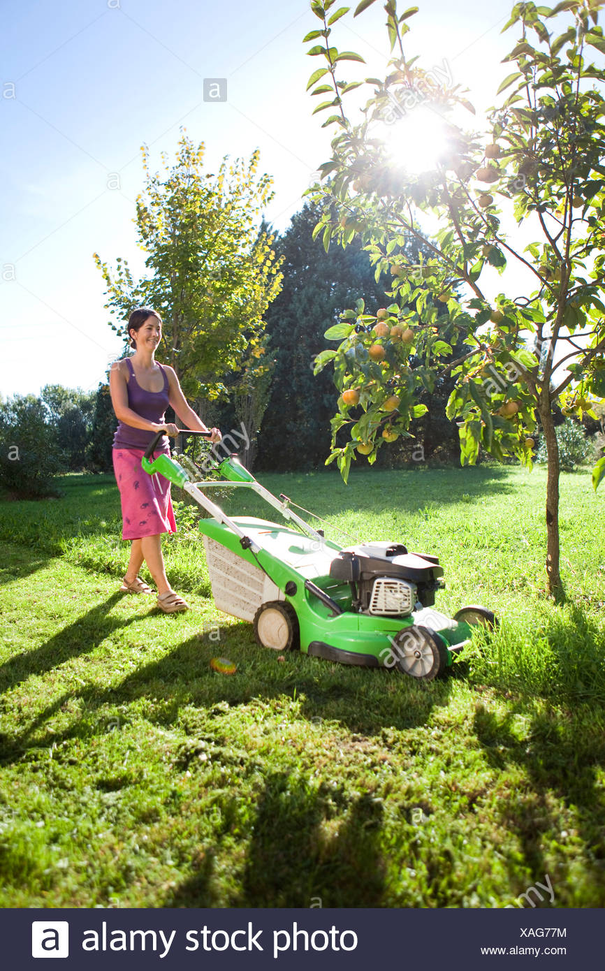 Woman Pushing Lawn Mower High Resolution Stock Photography and Images ...