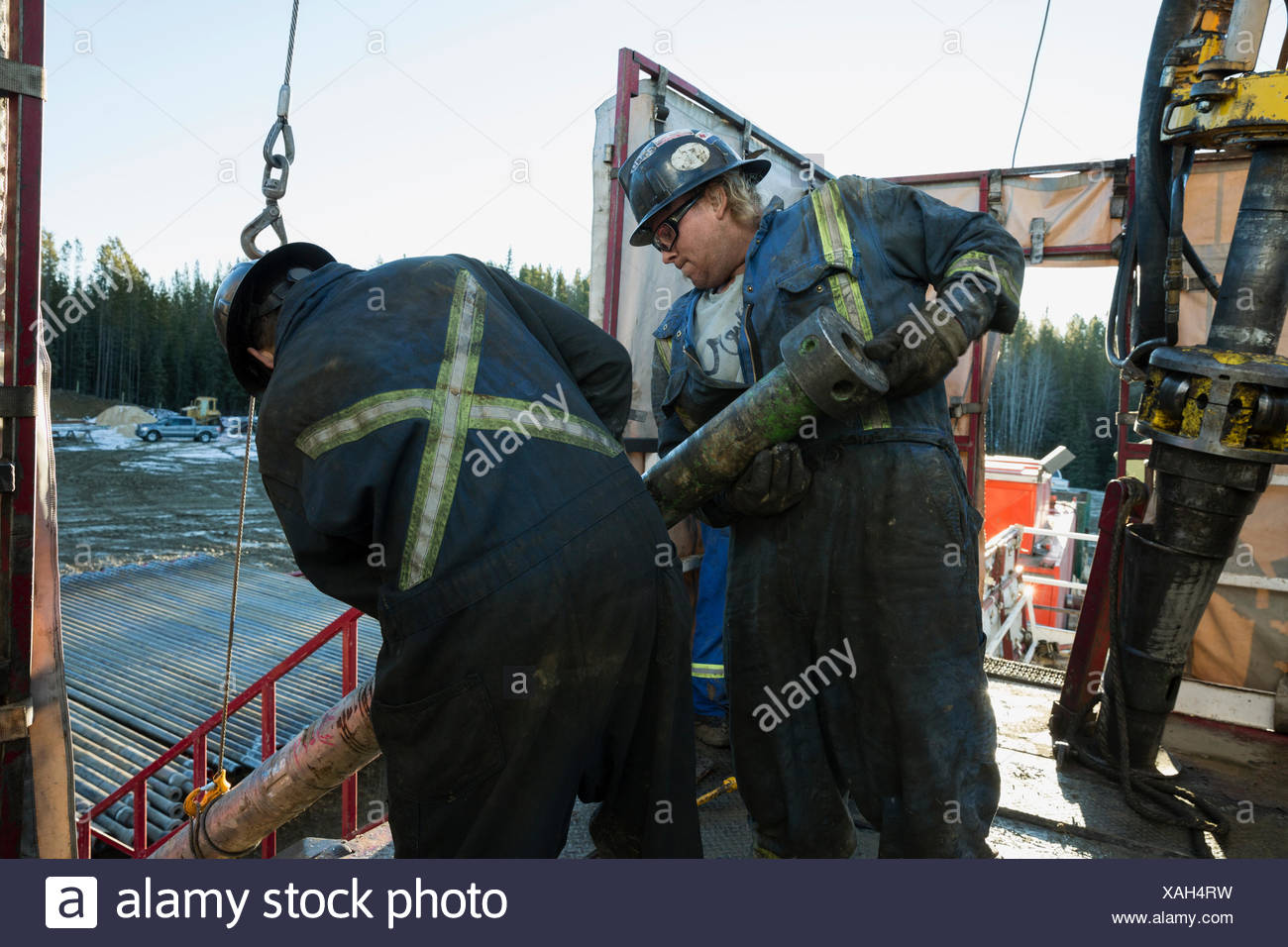 Three Young Oil Rig Workers Stock Photos & Three Young Oil Rig Workers ...