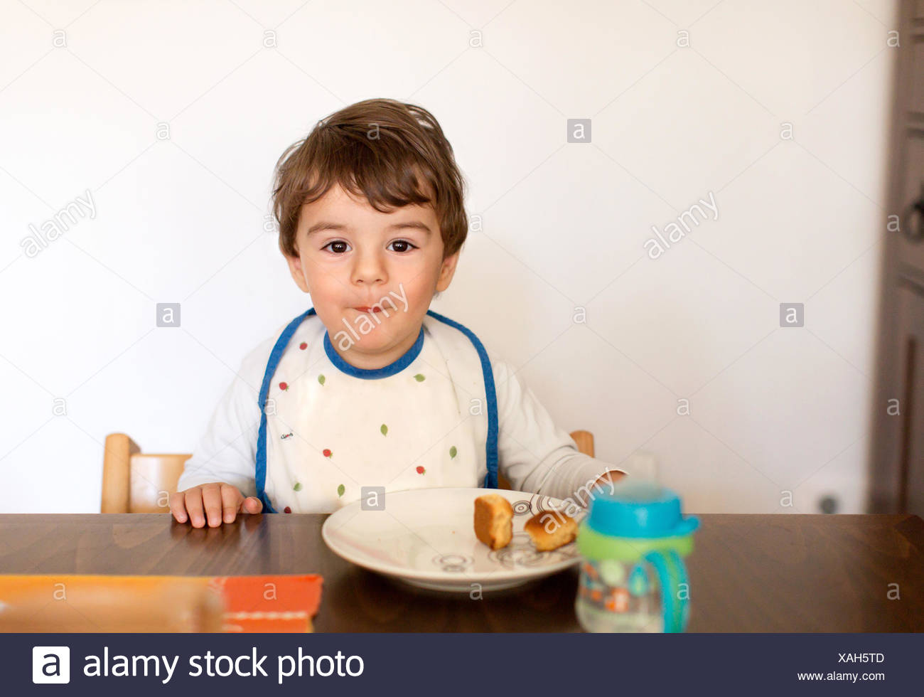 Sitting At Dining Table High Resolution Stock Photography and Images ...