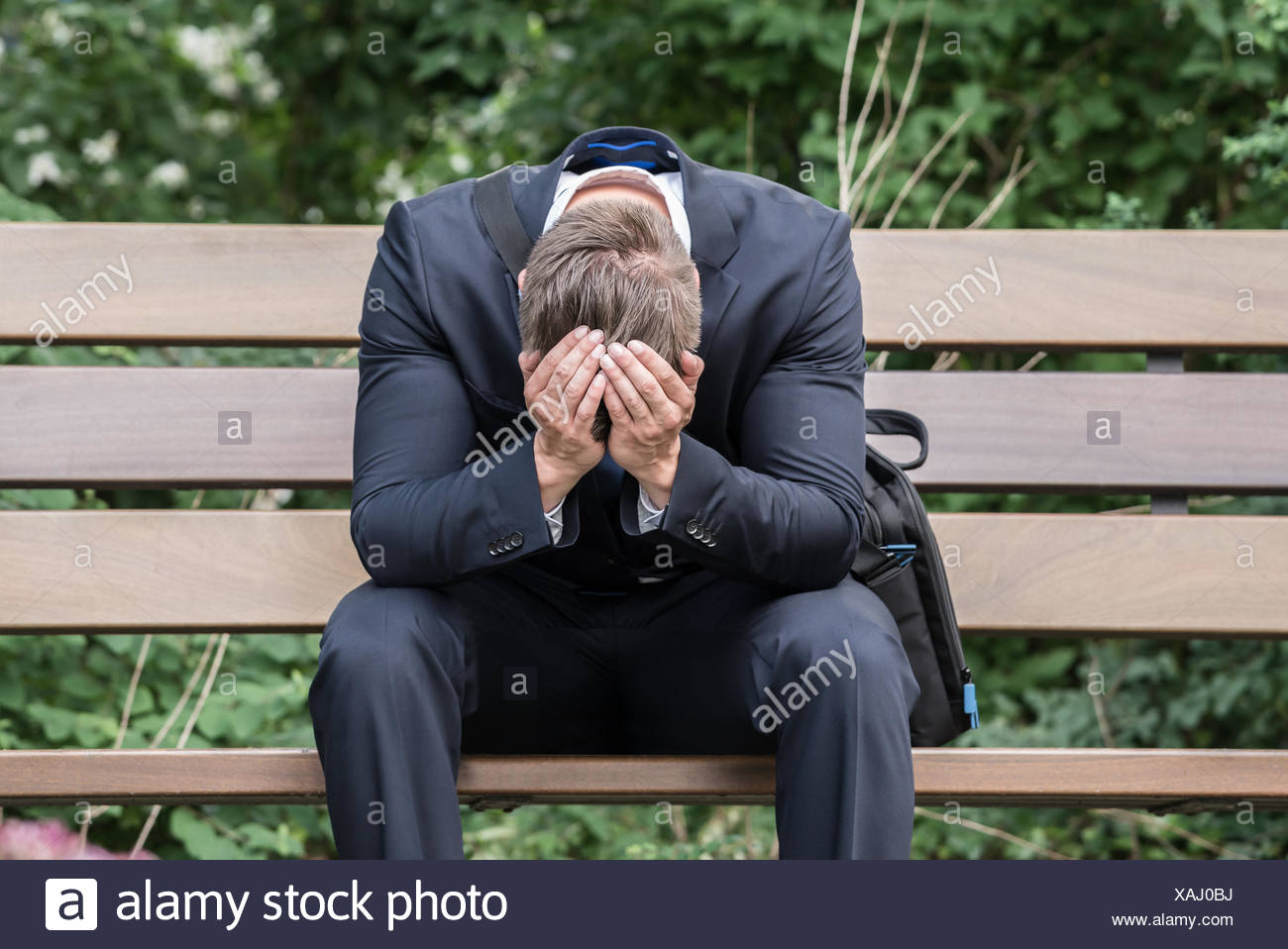 Depressed Man Sitting On Park Bench Stock Photos & Depressed Man ...