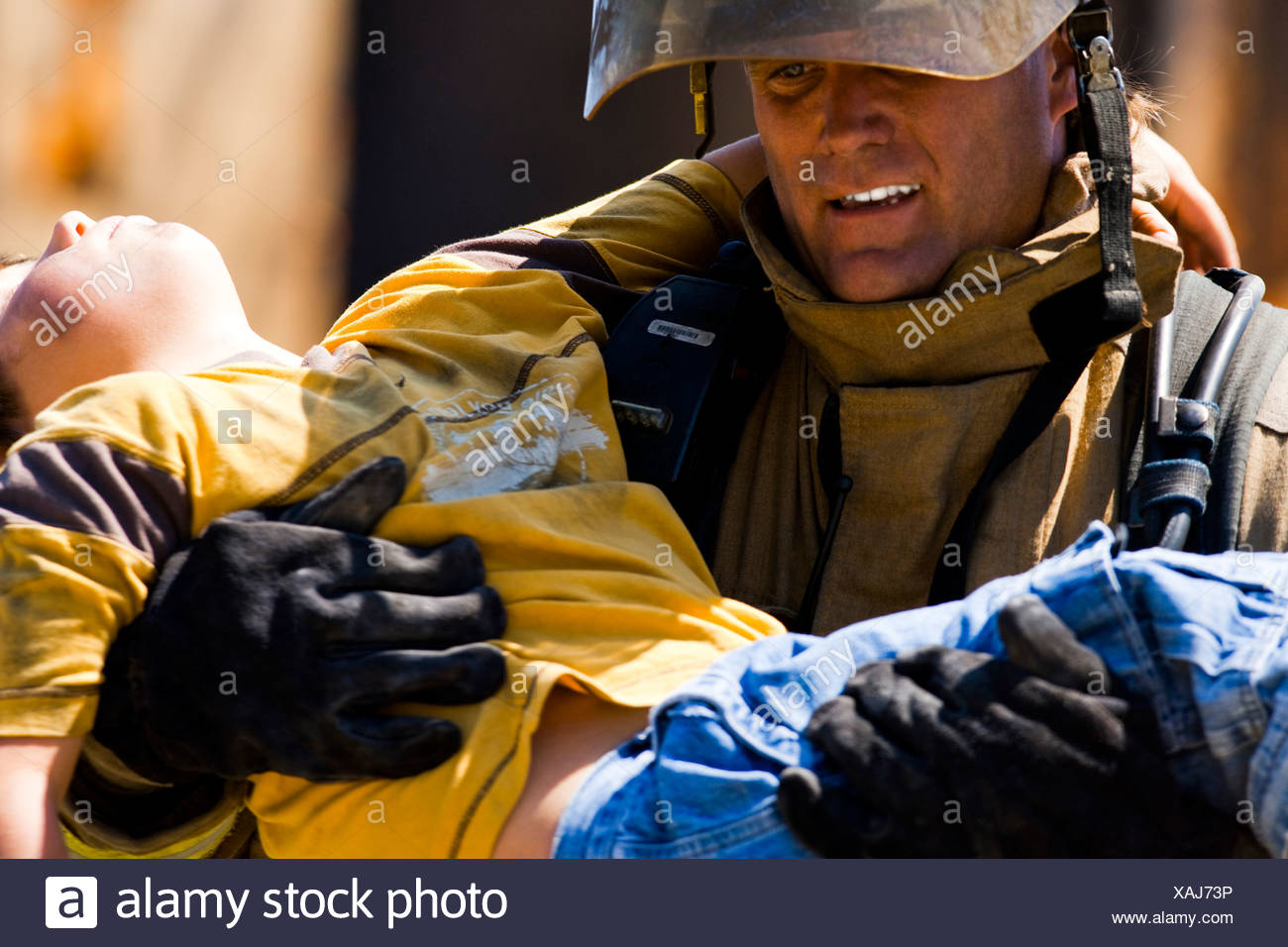 Firefighter Rescue Child Stock Photos & Firefighter Rescue Child Stock ...