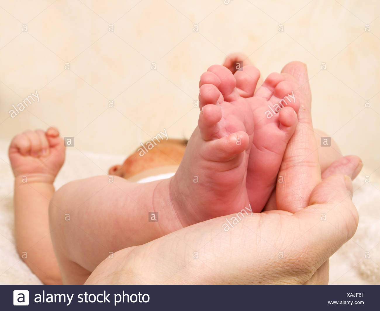 Baby Feet In Mother Hand High Resolution Stock Photography and Images ...