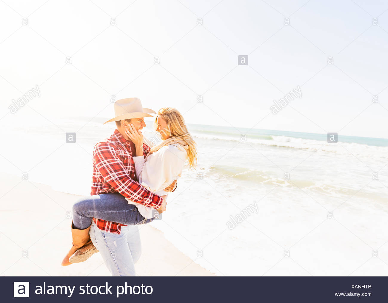 Woman Cuddling Man On Beach High Resolution Stock Photography and ...
