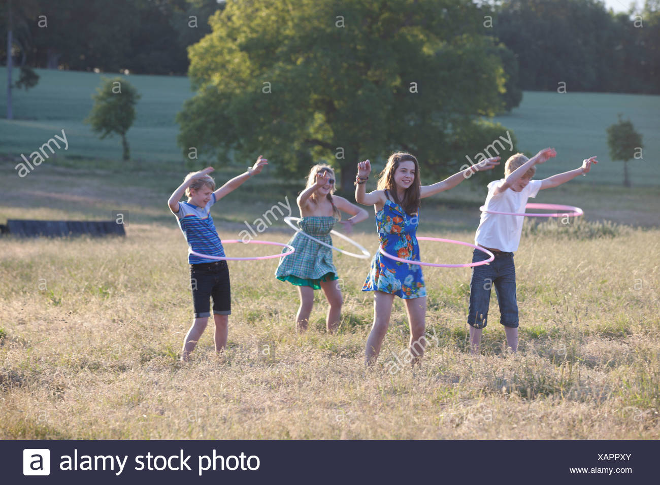 Children Playing Hula Hoops Stock Photos & Children Playing Hula Hoops ...