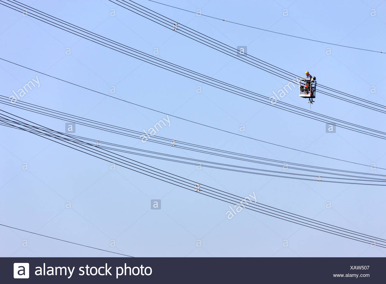 Man Working On High Voltage Power Lines High Resolution Stock ...