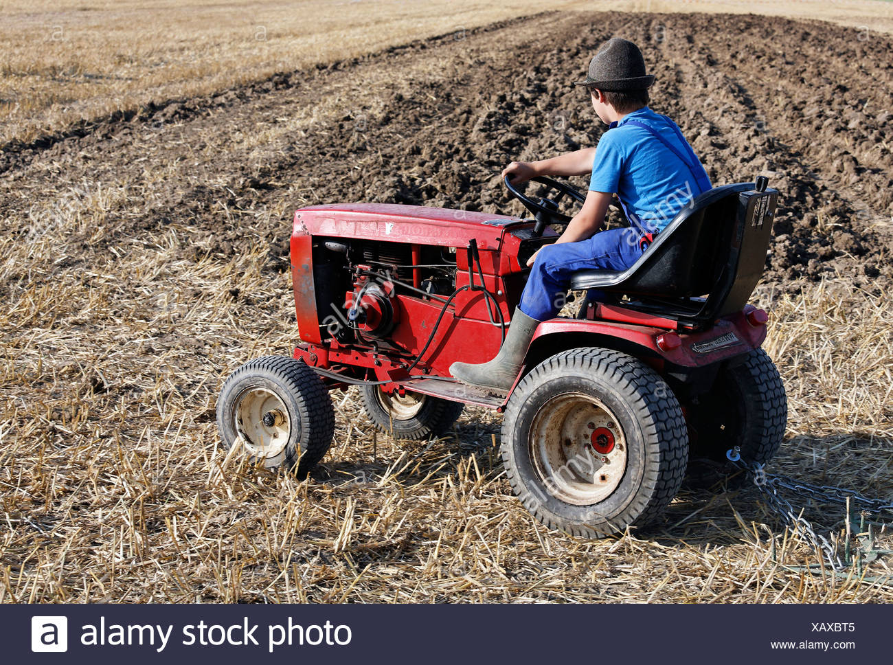 Young Boy Driving A Tractor High Resolution Stock Photography and ...