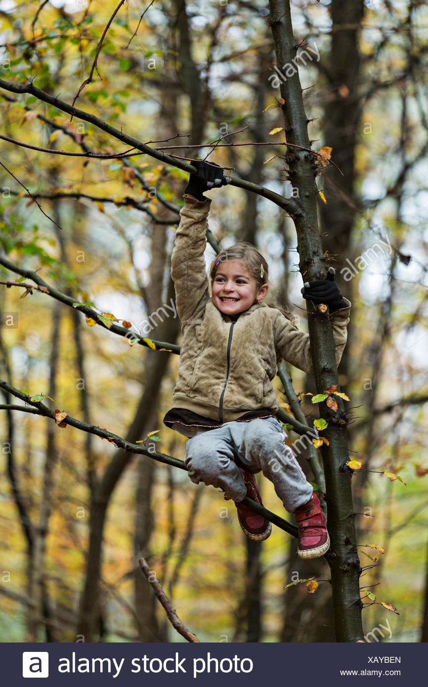 Girl Hanging From Tree High Resolution Stock Photography and Images - Alamy