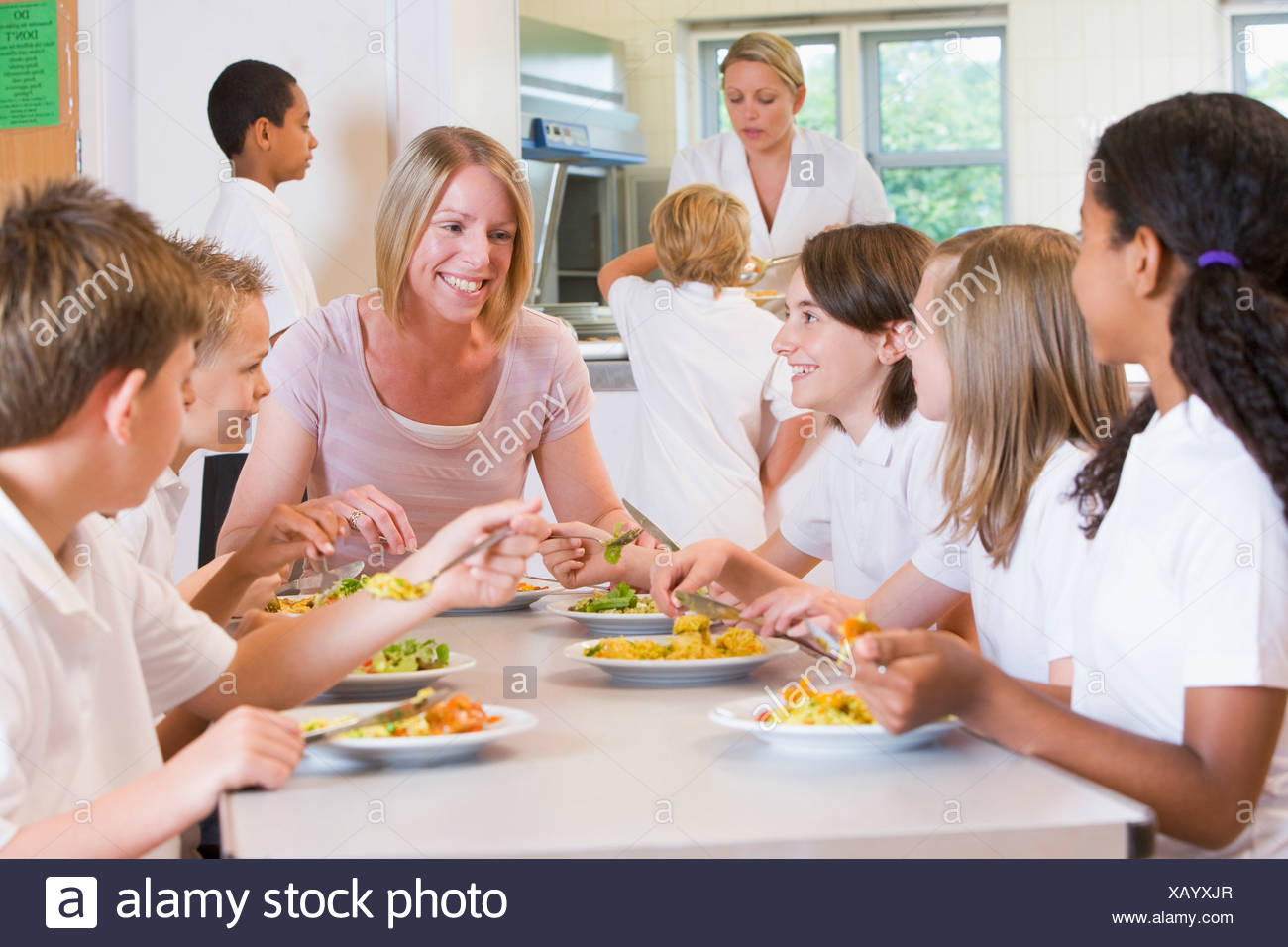 Students Eating At The School Cafeteria High Resolution Stock ...