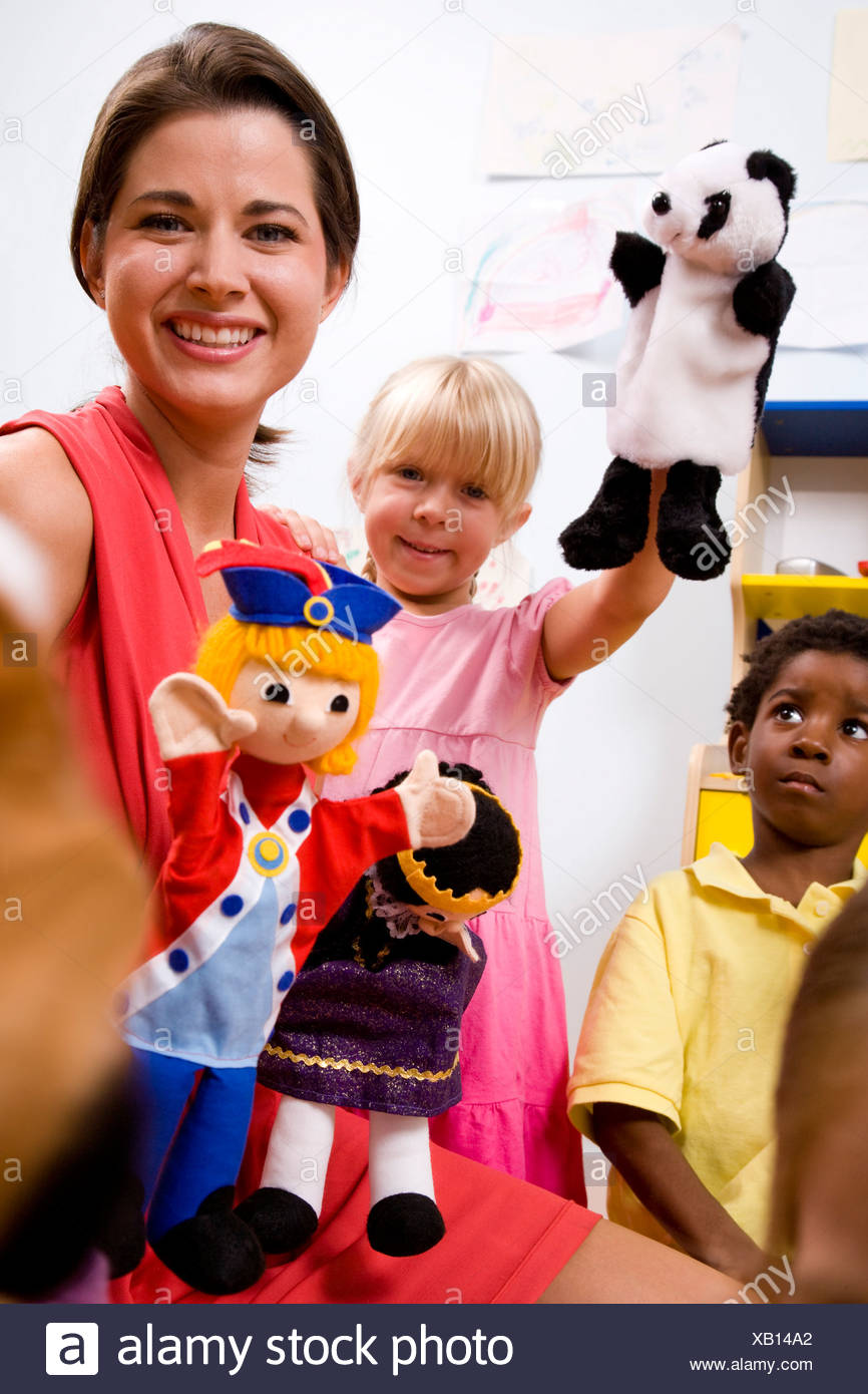 Teacher Preschool Children Playing Puppets High Resolution Stock ...