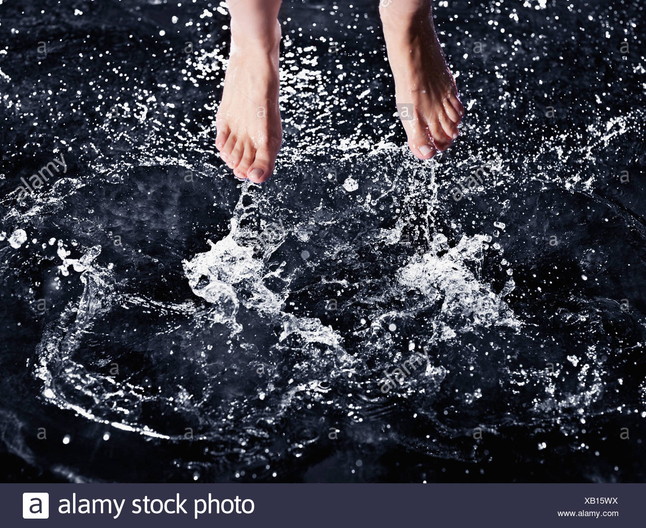 Splashing In Puddle Stock Photos & Splashing In Puddle Stock Images - Alamy