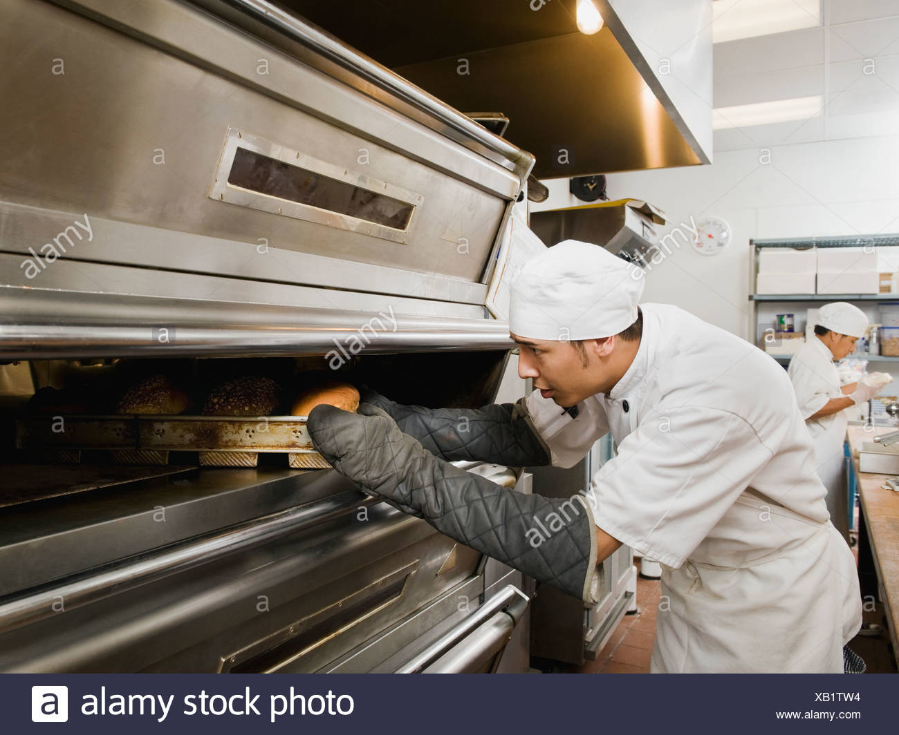 Putting Bread In Oven High Resolution Stock Photography and Images - Alamy