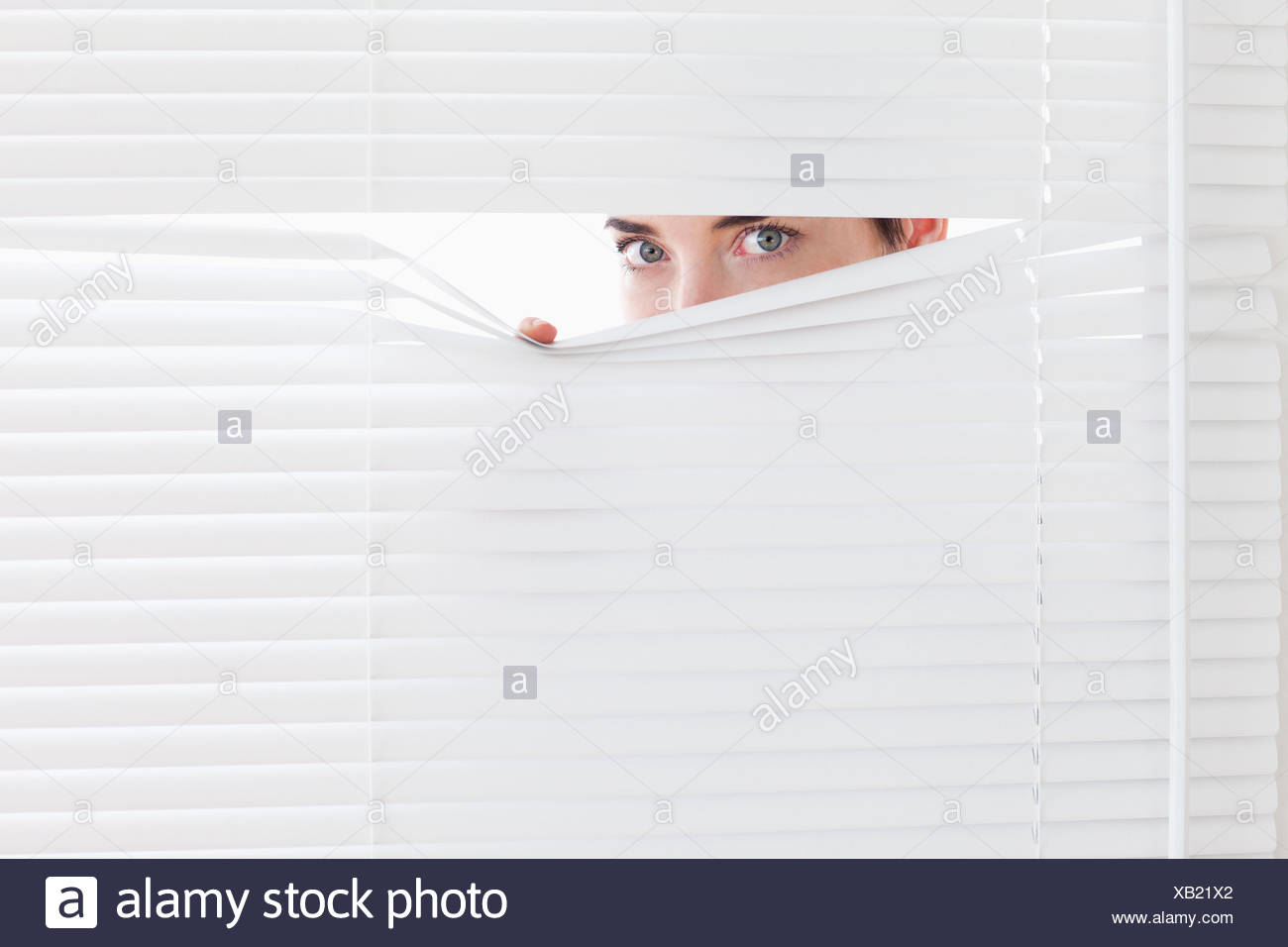 Beautiful Women Peeking Through Window Stock Photos & Beautiful Women ...