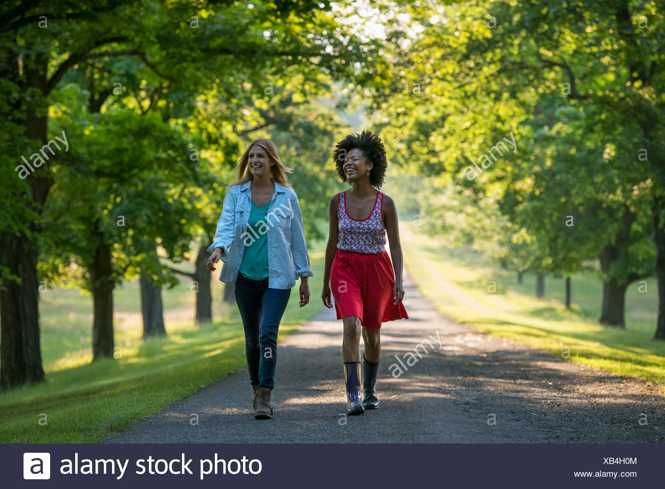 Two Young Beautiful Women Walking Stock Photos & Two Young Beautiful ...