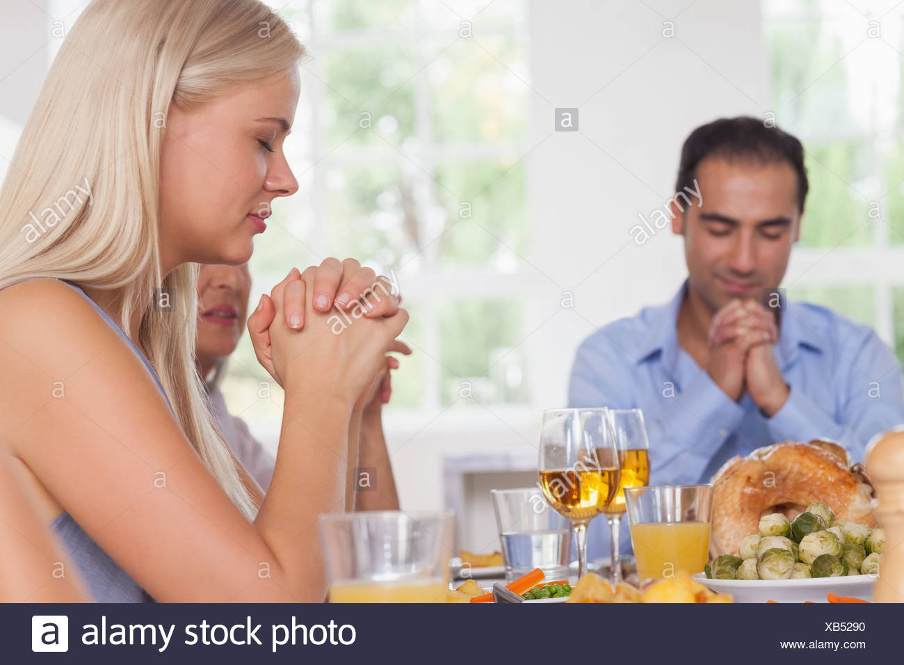 Family Saying Grace Thanksgiving Table High Resolution Stock ...