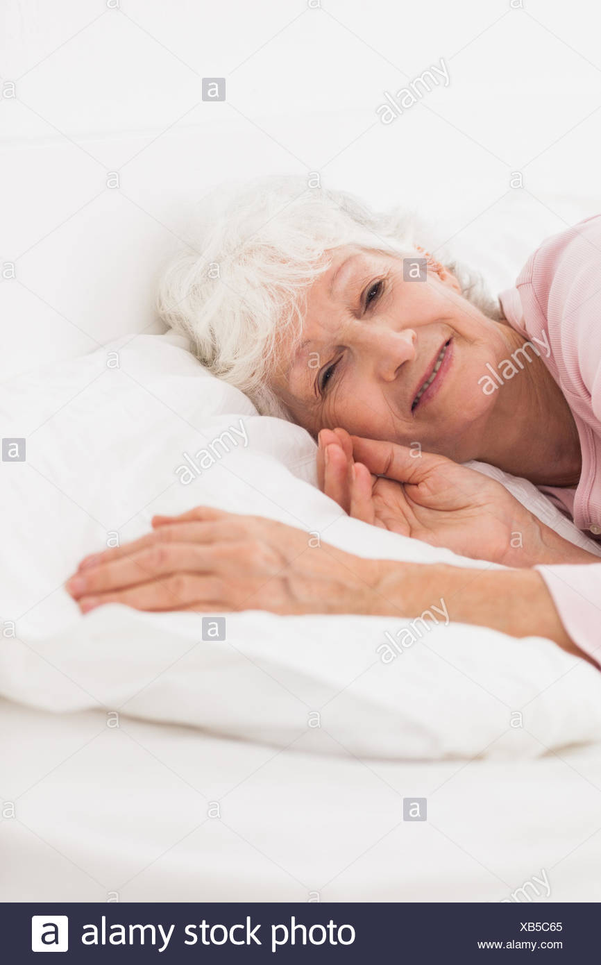 Elderly Woman Waking Up High Resolution Stock Photography and Images ...