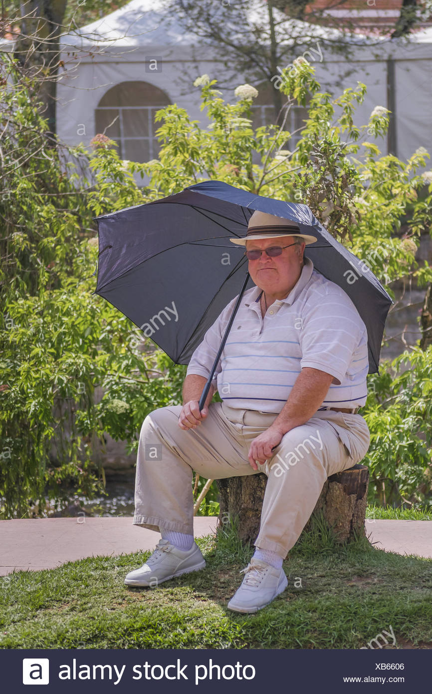 Fat Man Sitting Park High Resolution Stock Photography and Images - Alamy