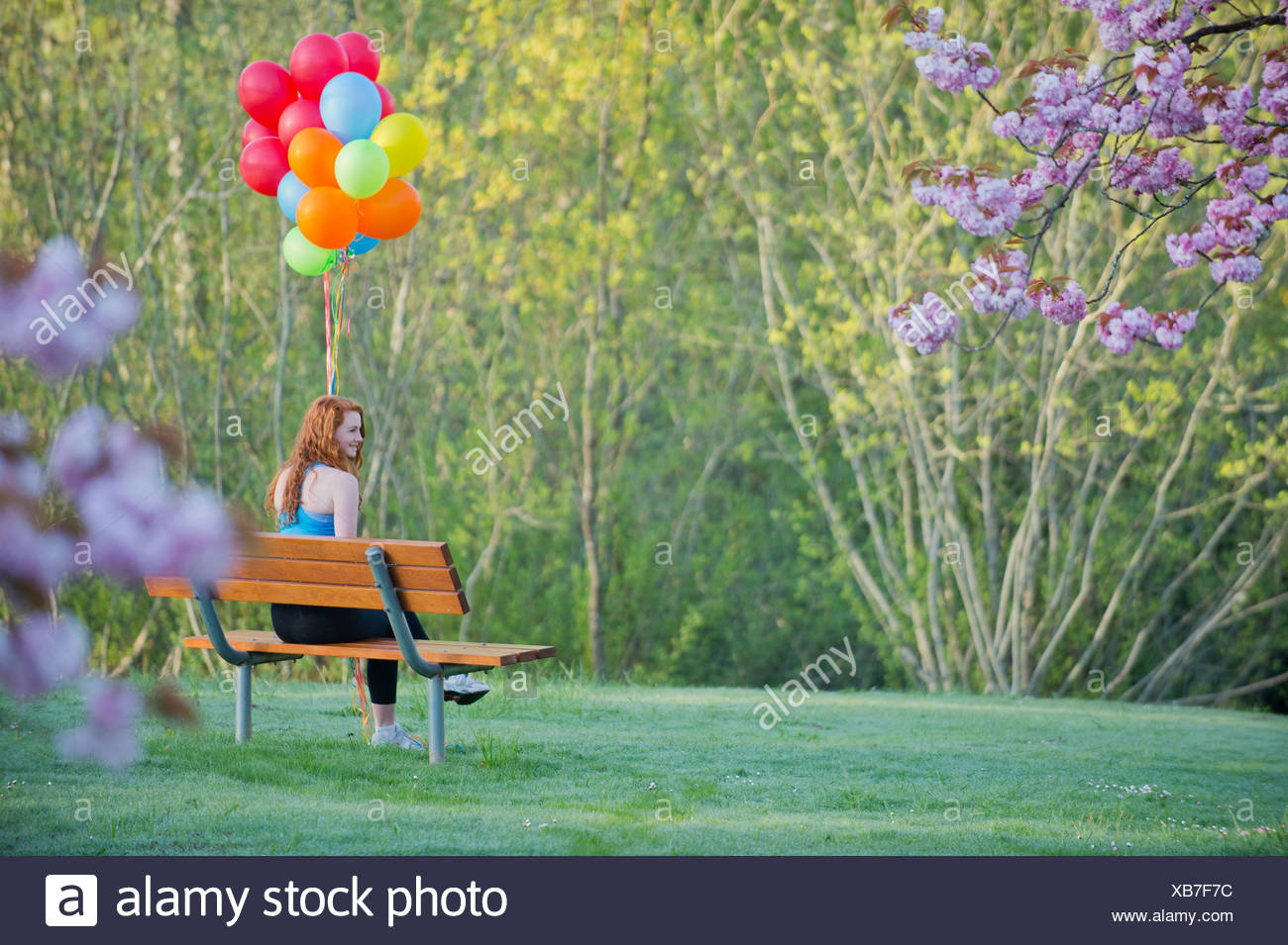 Girl Sitting On Park Bench High Resolution Stock Photography and Images ...