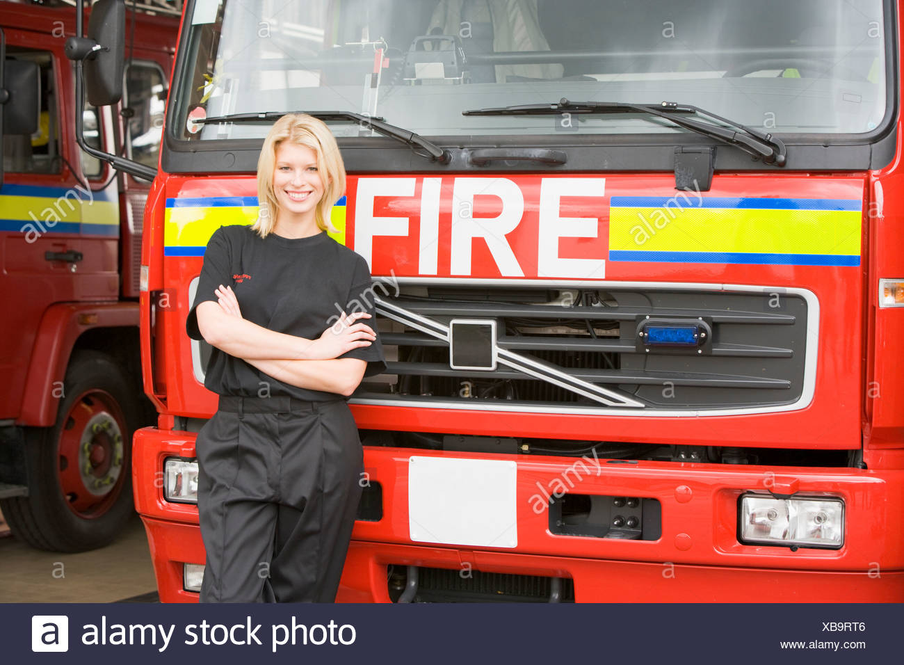 Firefighter In Front Of Fire Truck High Resolution Stock Photography ...