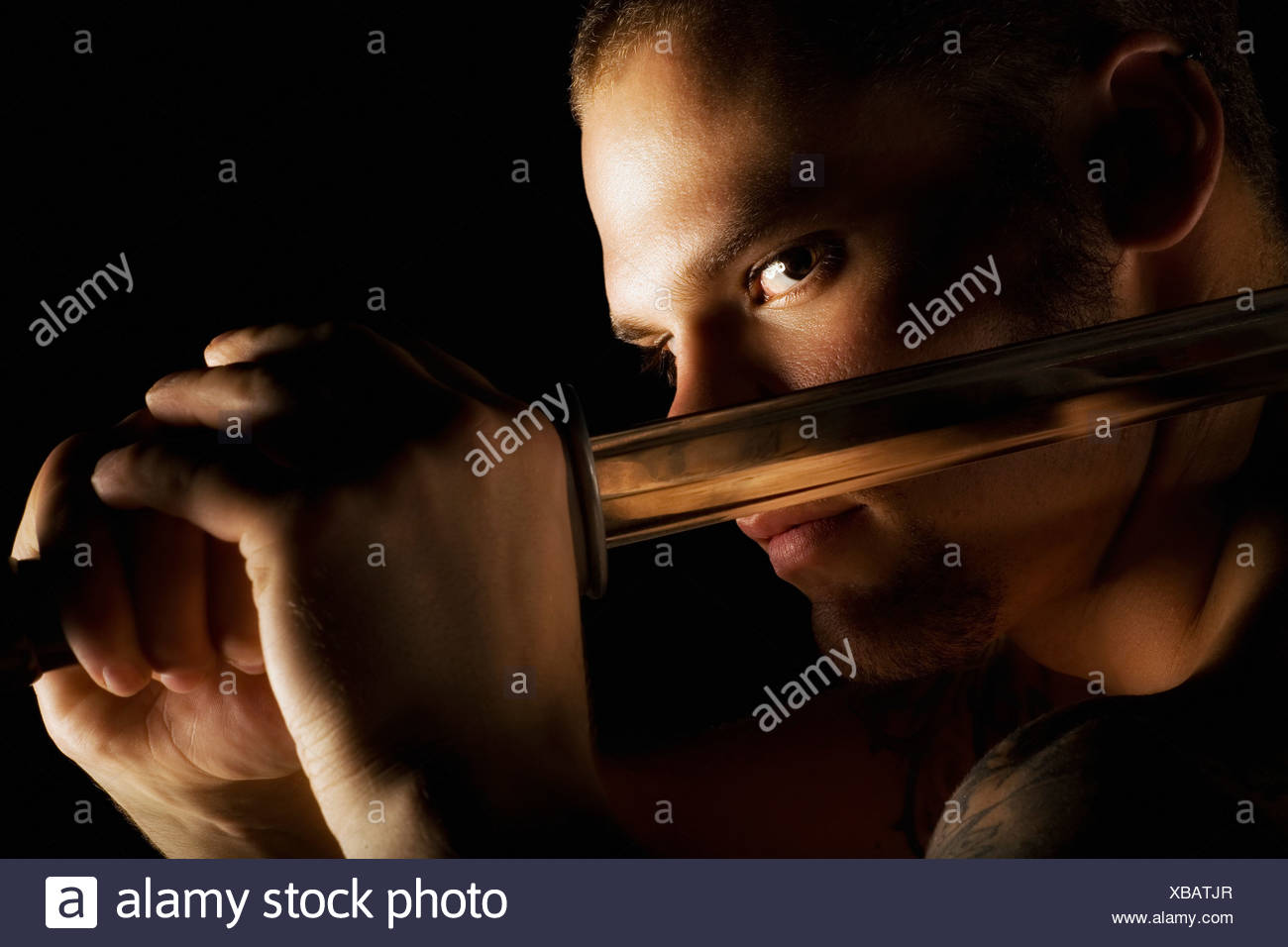 Man Holding Sword Stock Photos & Man Holding Sword Stock Images - Alamy