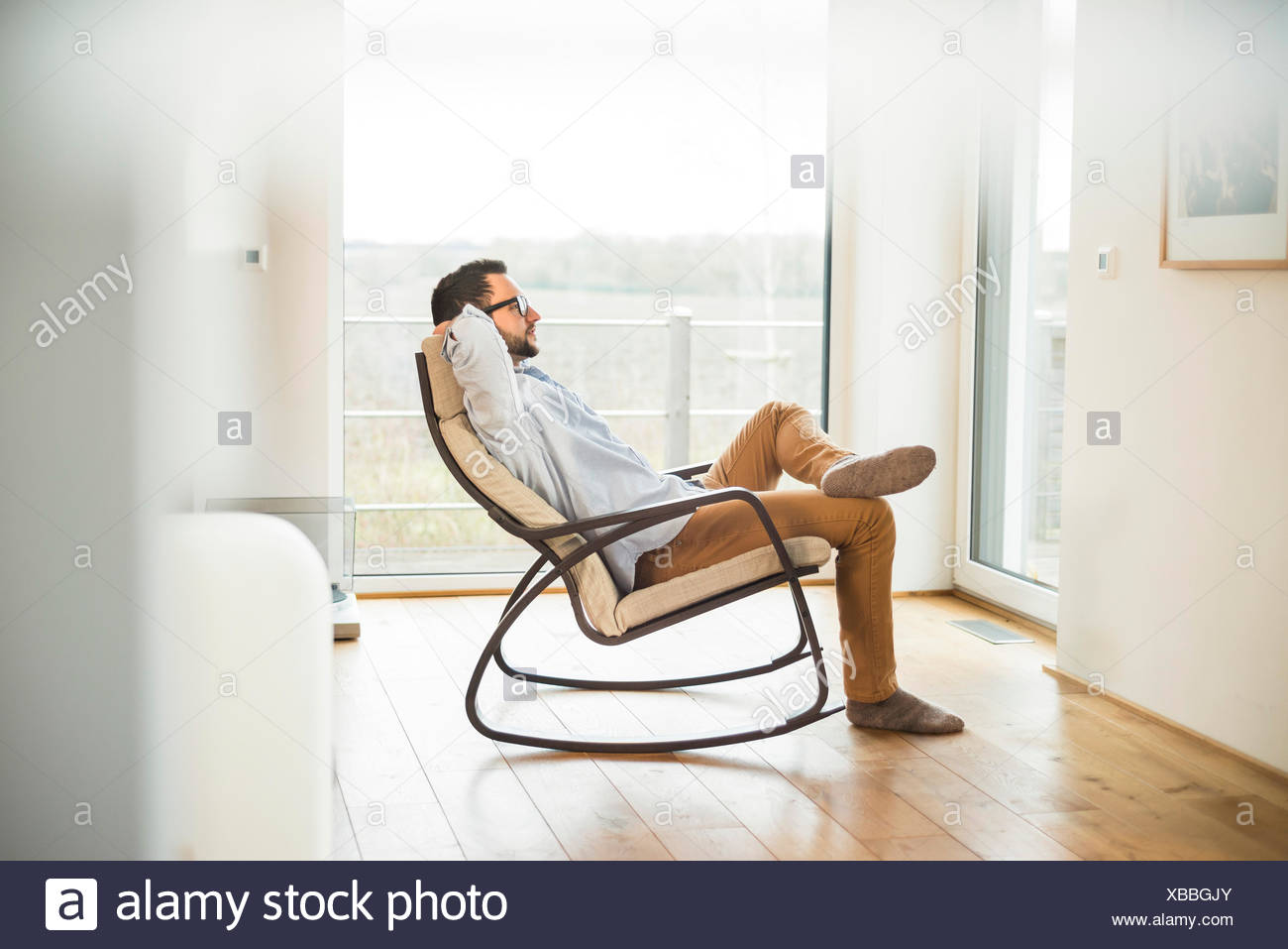Man Sitting On Rocking Chair High Resolution Stock Photography and ...