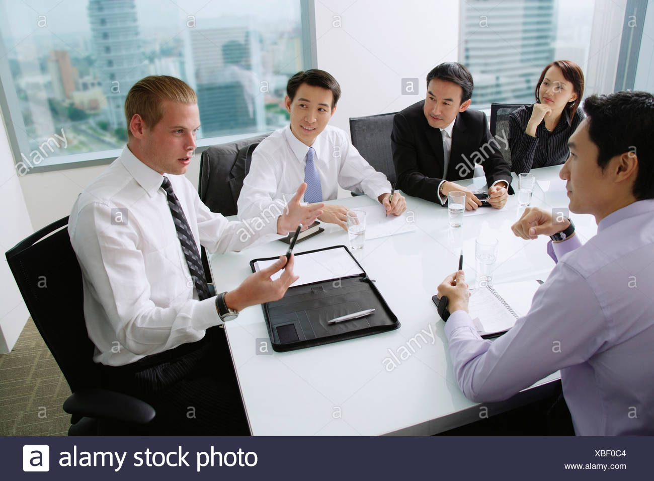 Executives Sitting Around Conference Table Stock Photos & Executives ...