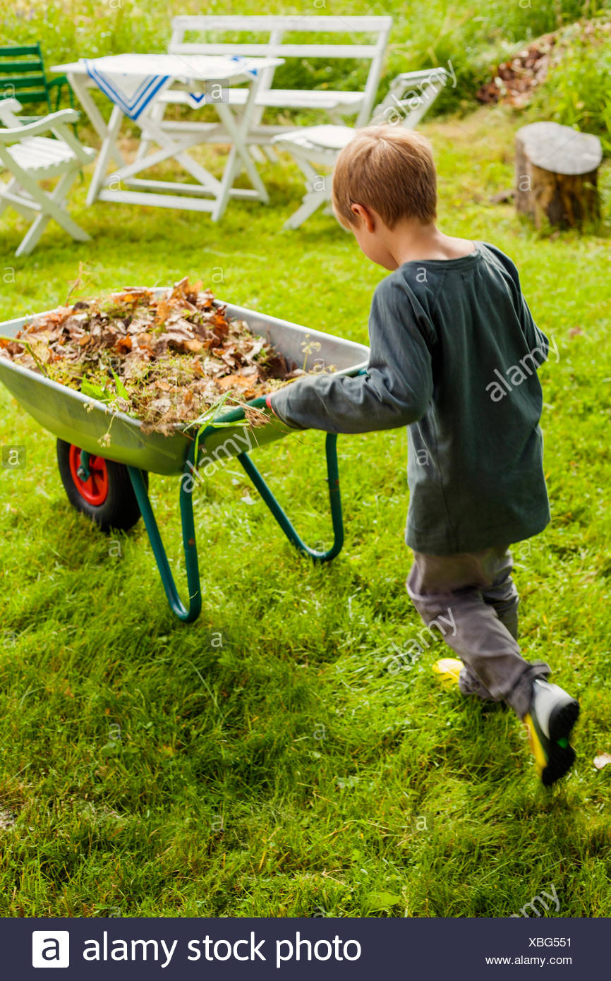 Wheelbarrow Children Wheelbarrow High Resolution Stock Photography and ...