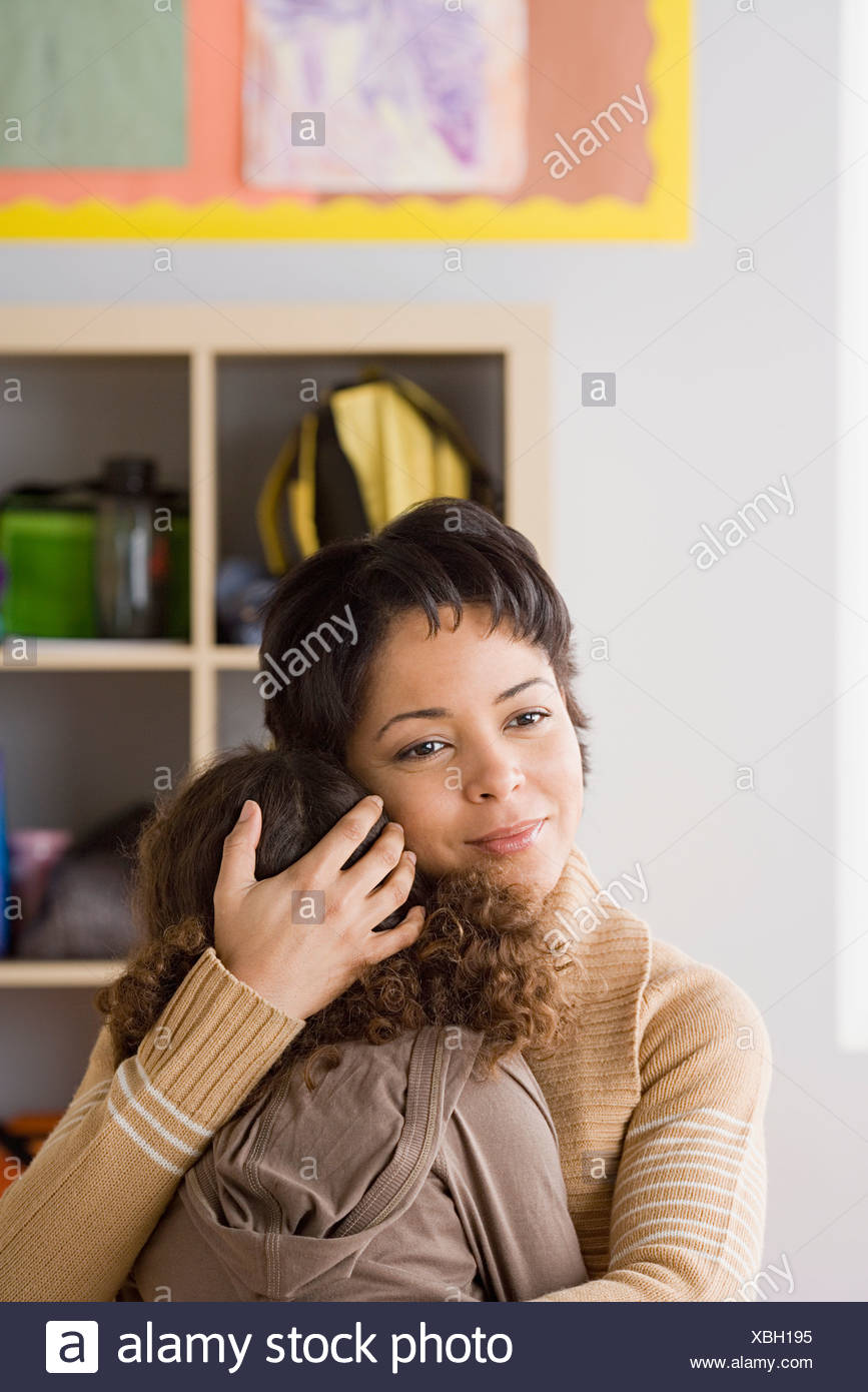 Teacher And Child Comforting High Resolution Stock Photography and ...